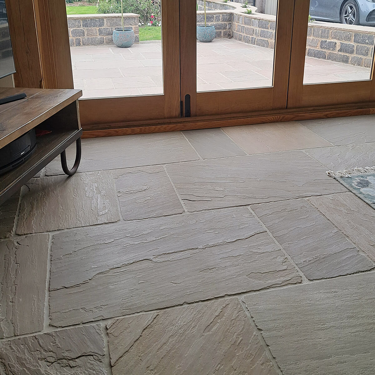 Tudor Brushed Sandstone Outdoor Paving Slabs | StoneSuperstore